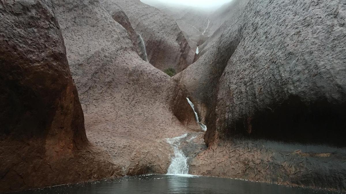 Record-breaking storms leave Australia’s iconic Uluru with waterfalls ...
